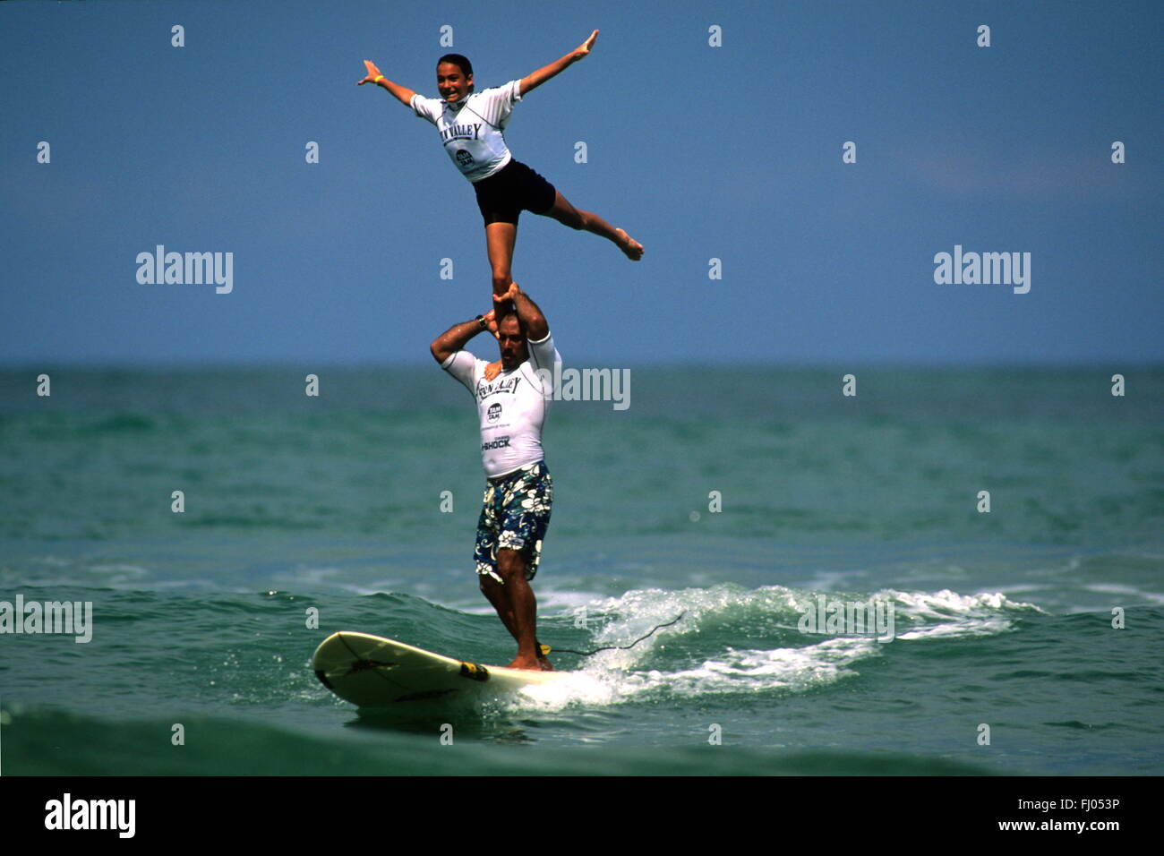 tandem surfing choreographed by the waves Stock Photo - Alamy