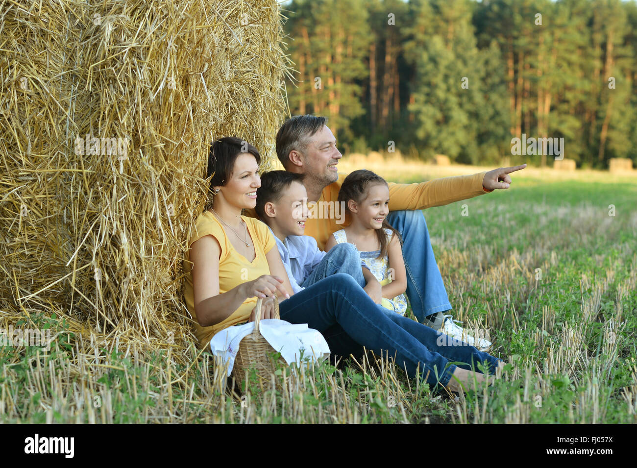 happy family at field Stock Photo - Alamy