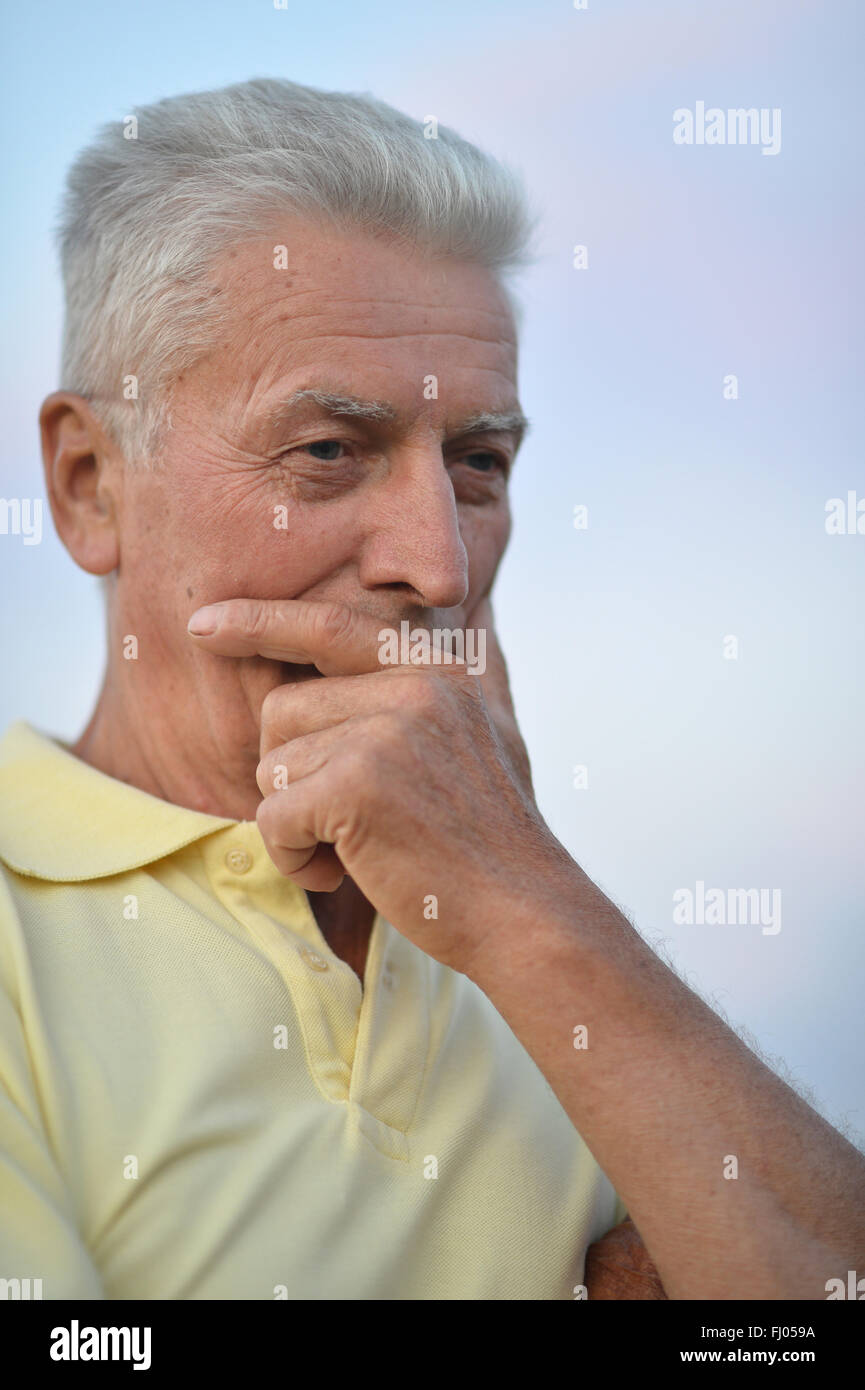 Senior man thinking Stock Photo - Alamy