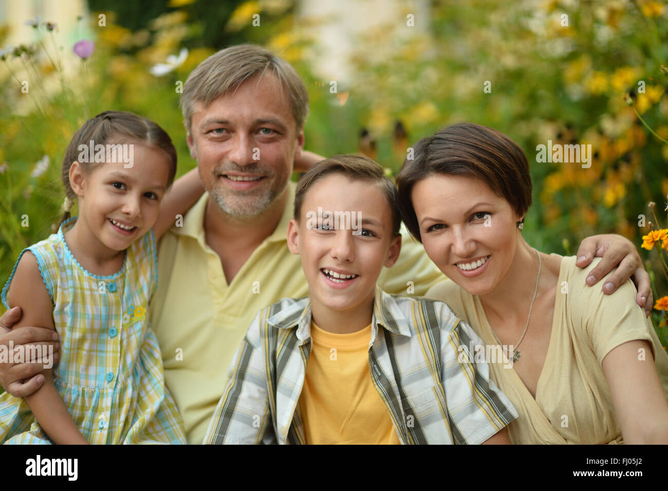 Family resting in summer park Stock Photo - Alamy
