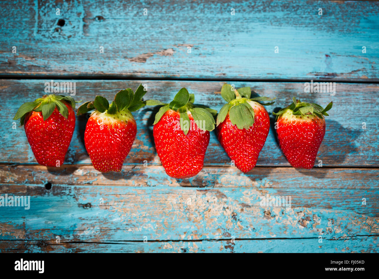 Five strawberries hi-res stock photography and images - Alamy