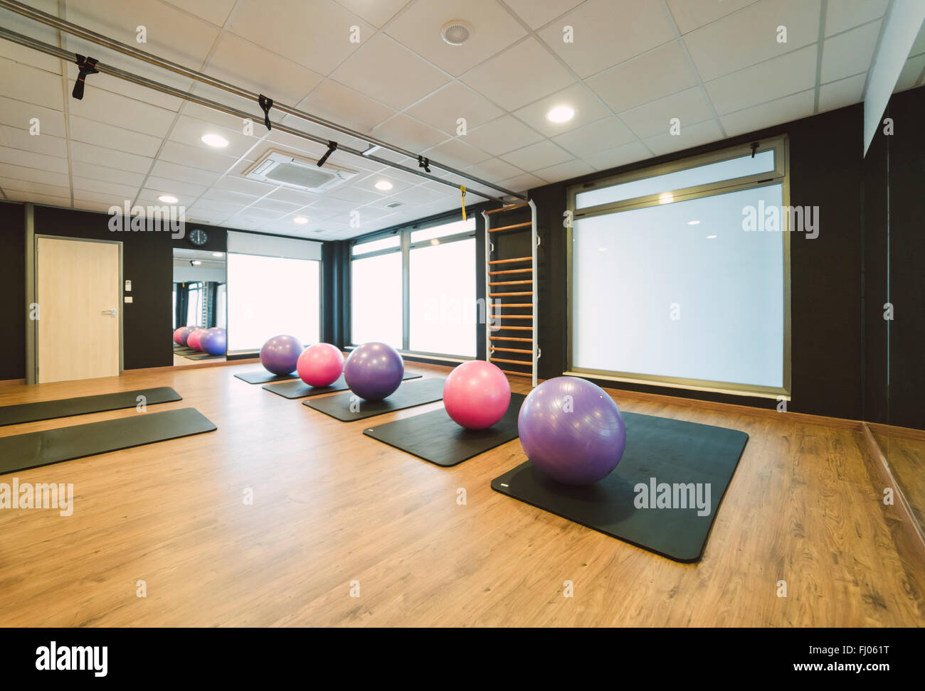Training room in a pilates gym Stock Photo - Alamy