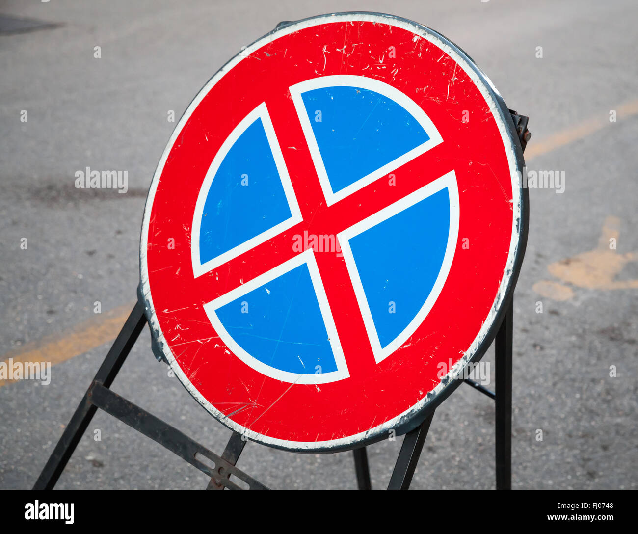 Round road sign stands on urban roadside, standing is prohibited Stock ...