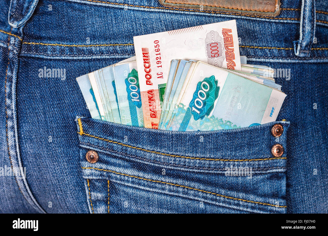 Russian rouble banknotes sticking out of the back jeans pocket Stock ...