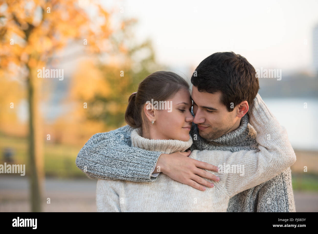young couple in the park, hugging, in love Stock Photo - Alamy