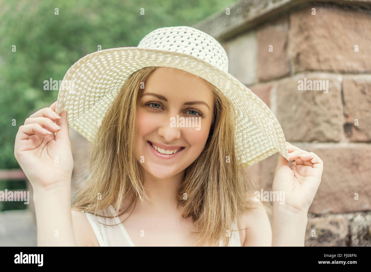 Beautiful girl holding hands face hi-res stock photography and images - Alamy