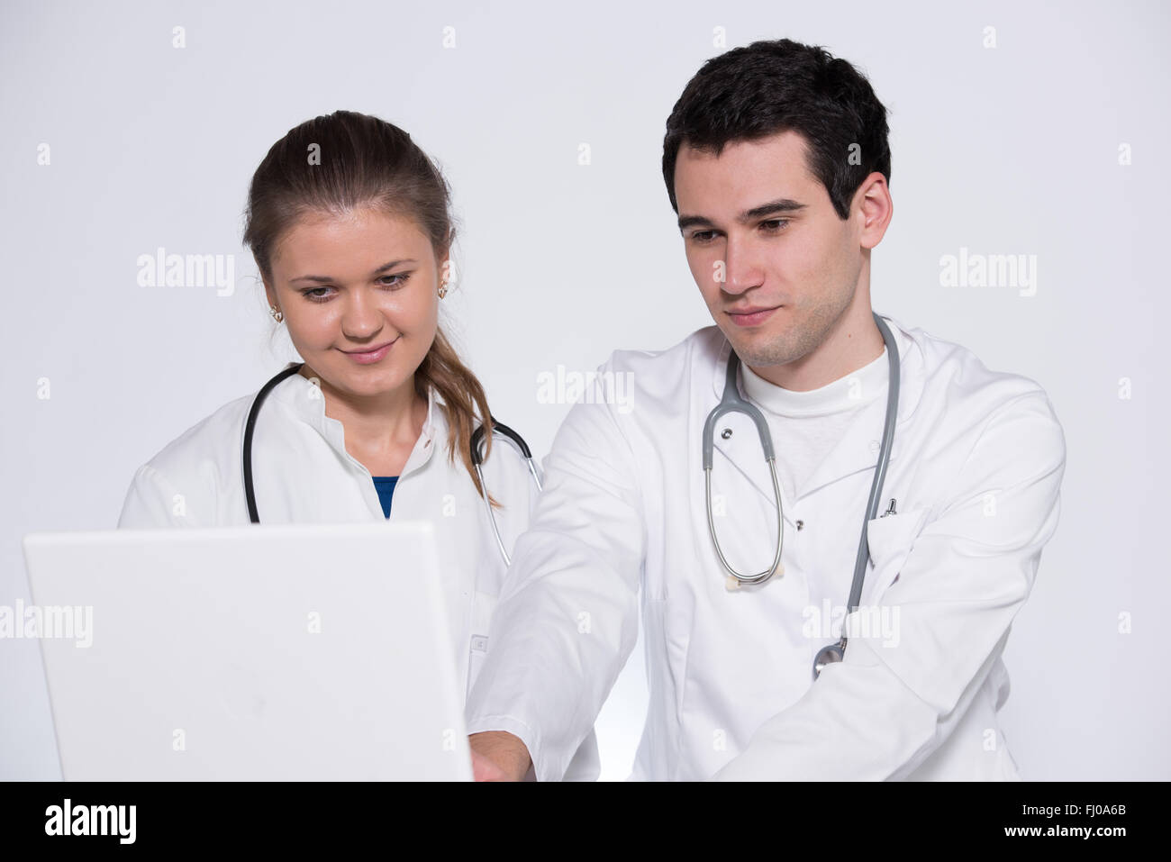 Group of doctors looking in computer hi-res stock photography and ...
