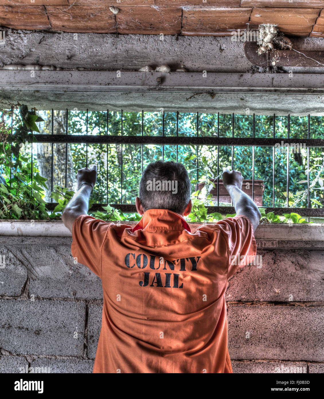 man holding jail bars Stock Photo - Alamy