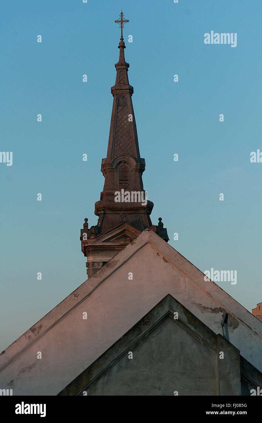 Old roof tops and a steeple of a catholic church. Shapes Stock Photo ...