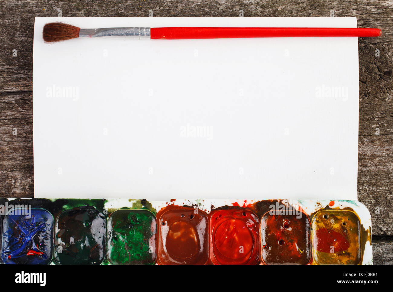 paints for painting and brush with blank white paper sheet Stock Photo ...