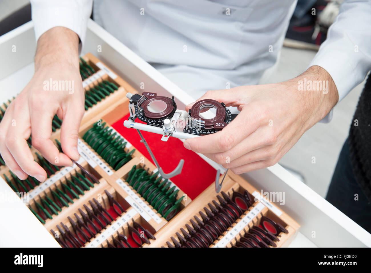 Optometrist, optician doctor working Stock Photo - Alamy