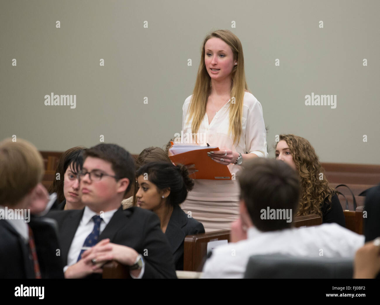 Teen girl acting as jury foreman announces her panel's verdict during ...
