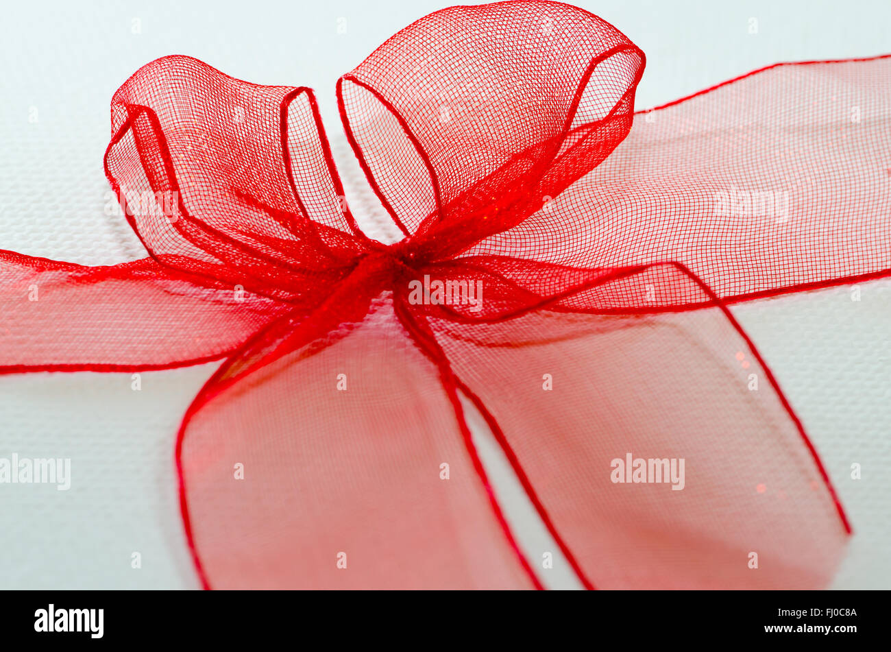 red ribbon on white background Stock Photo - Alamy