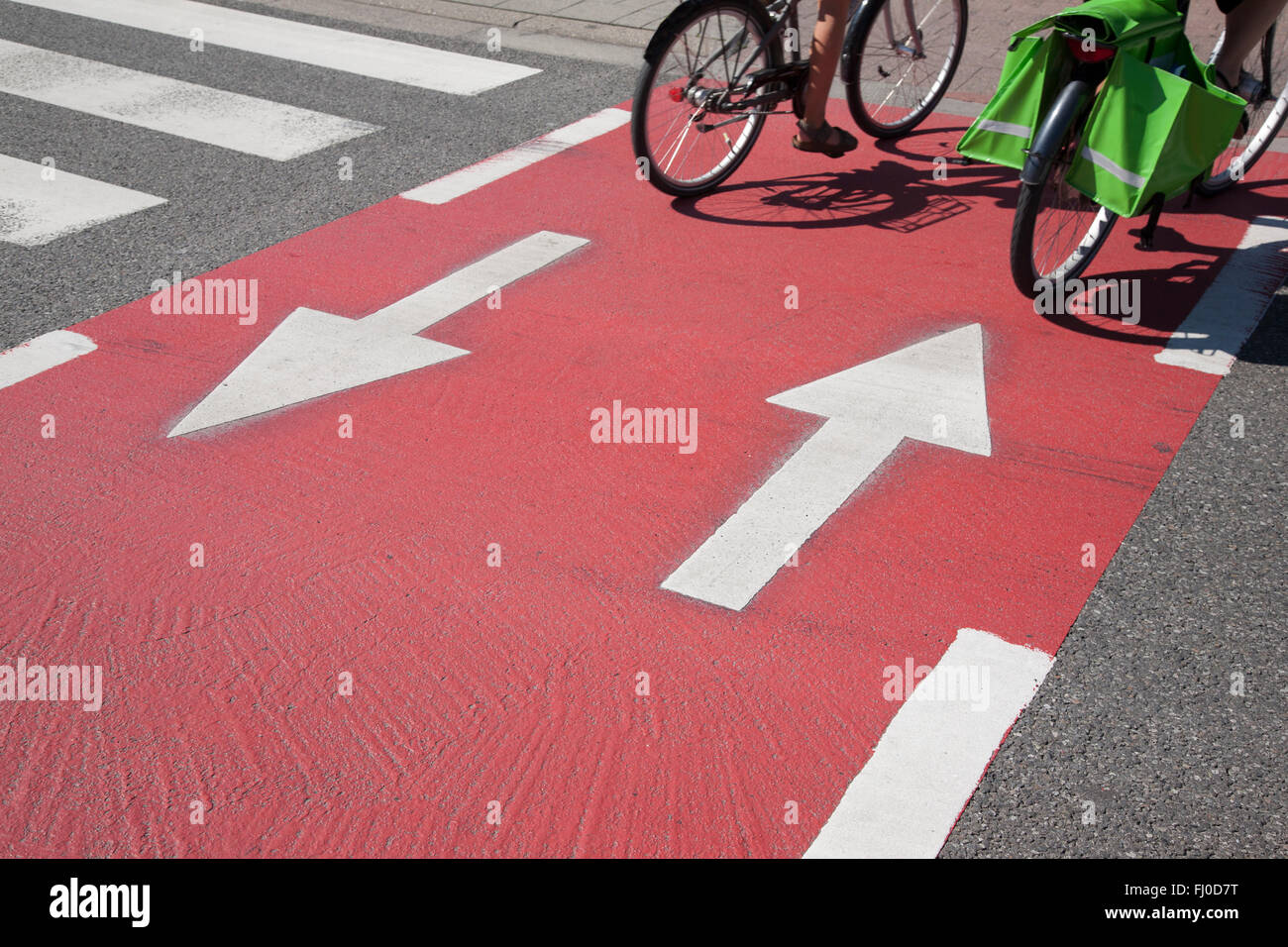 Cyclist on Bike Lane with Arrow Symbol Stock Photo - Alamy