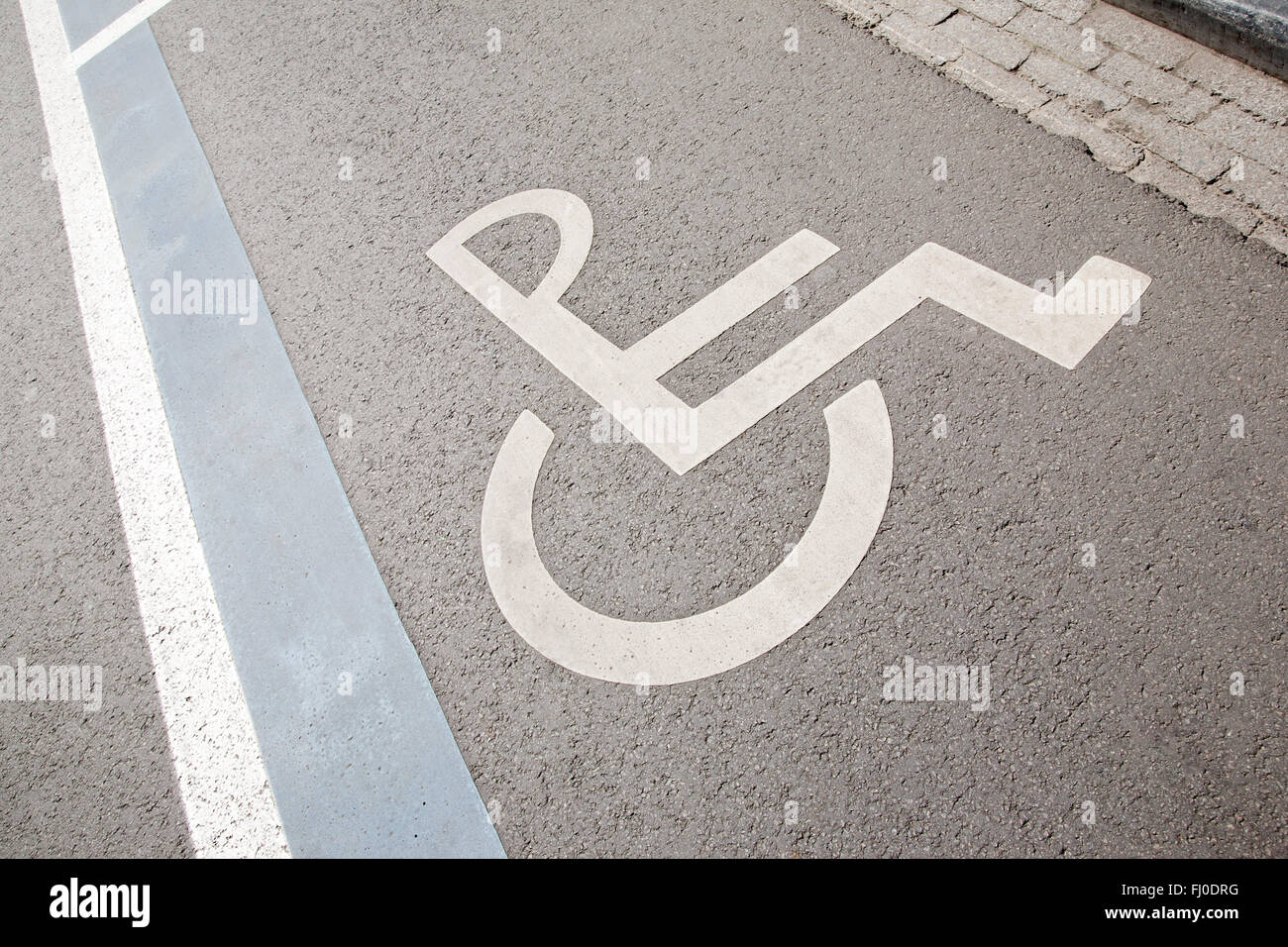 Disabled Parking Sign on Street Surface Stock Photo - Alamy