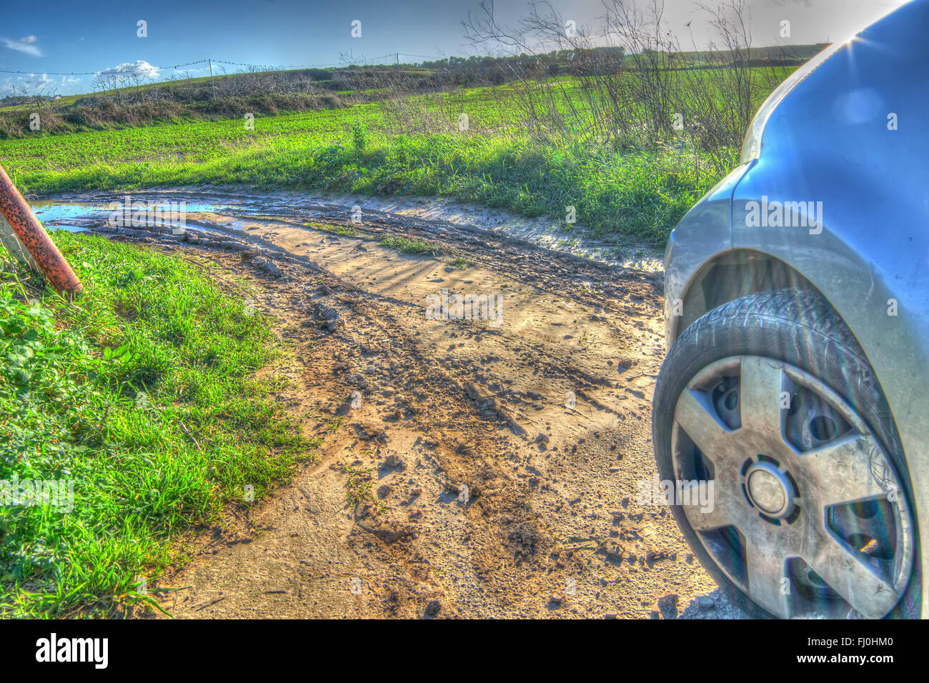 closeup of a car on a dirt road Stock Photo - Alamy