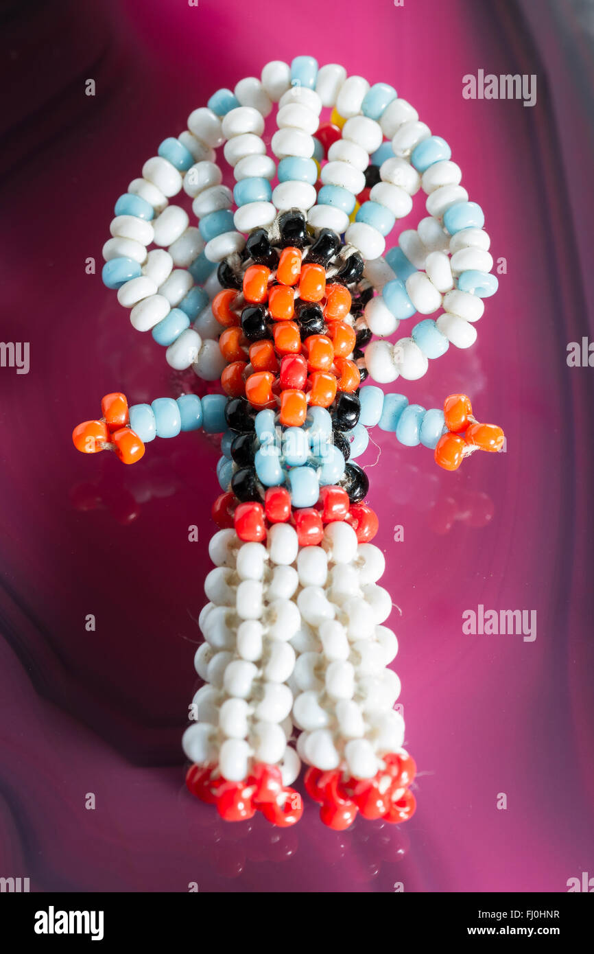 close up of an ale toy made with needs made to like like a native ...