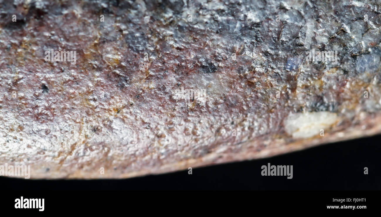 close up of a stone with an interesting texture and multiple colors ...