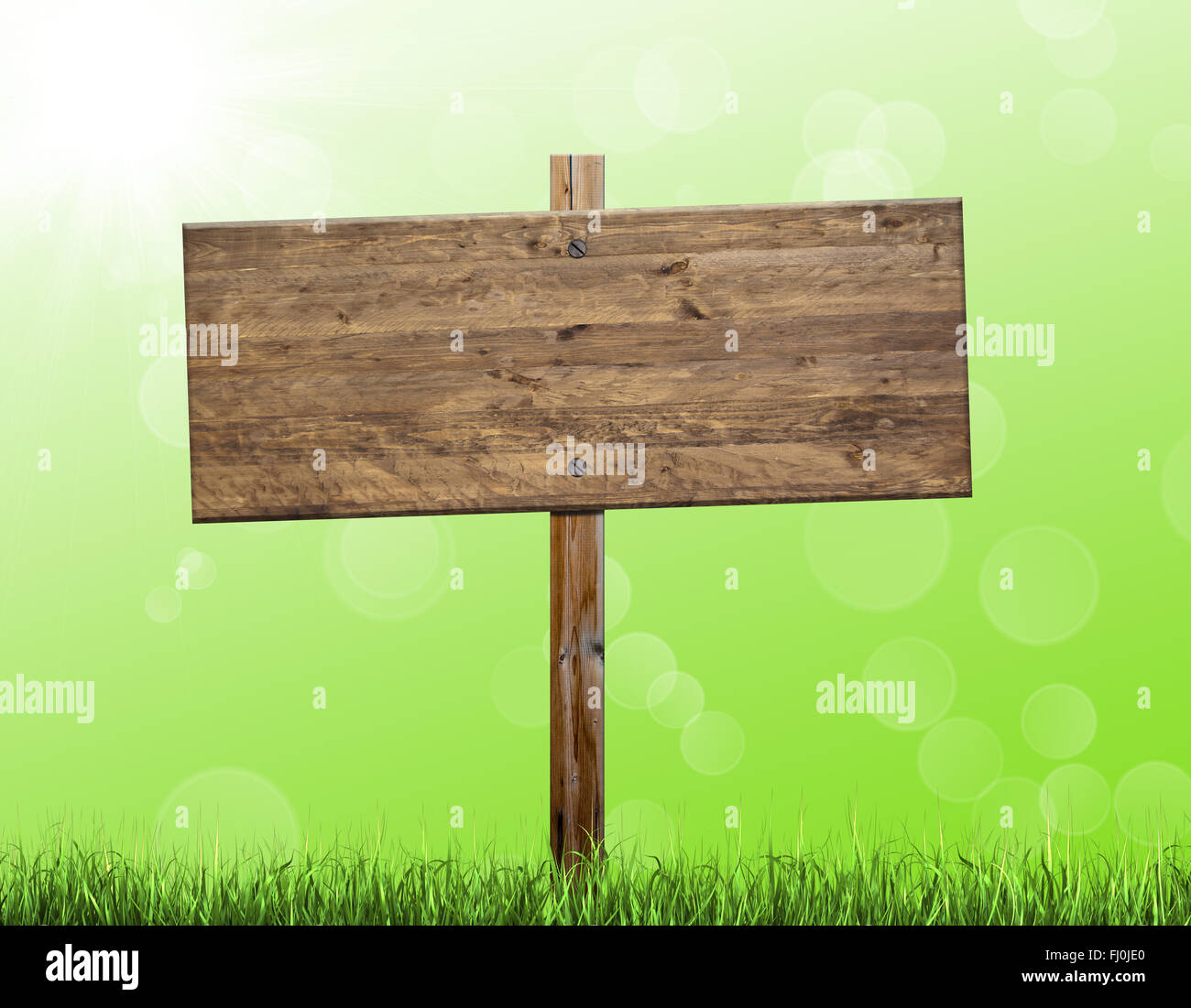 Wooden billboard isolated on a green background Stock Photo - Alamy