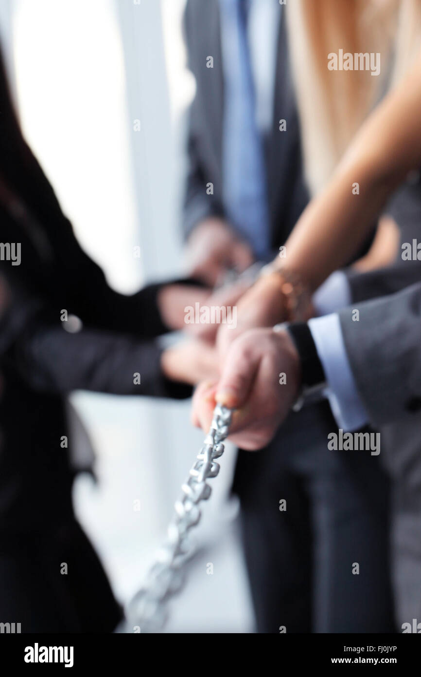 Businessmen pulling chain, teamwork togetherness concept Stock Photo ...
