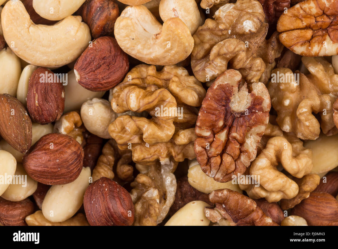lot of different types of nuts mix for background Stock Photo - Alamy