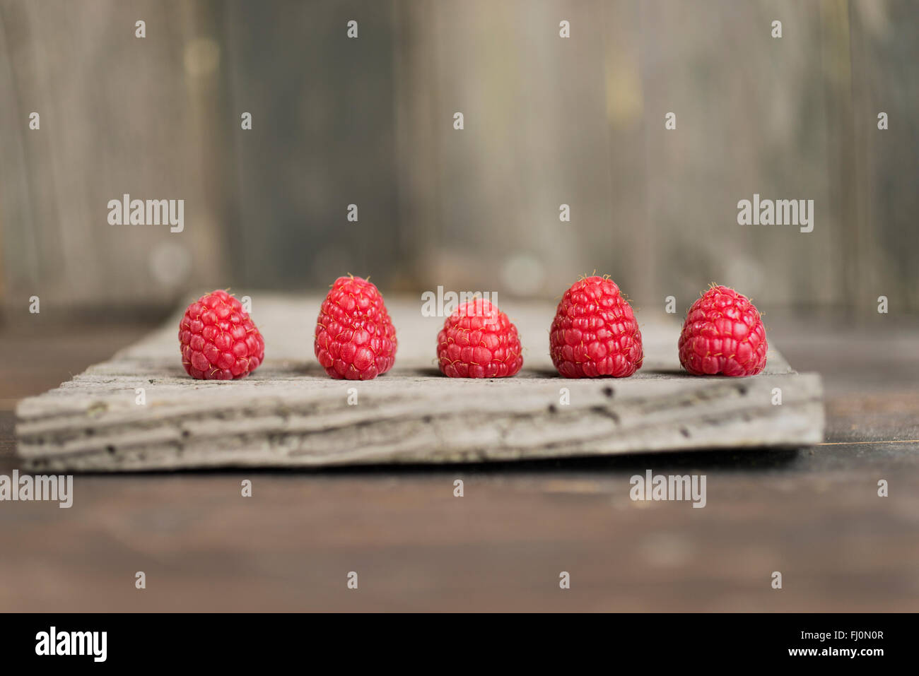 Row of raspberries hi-res stock photography and images - Alamy