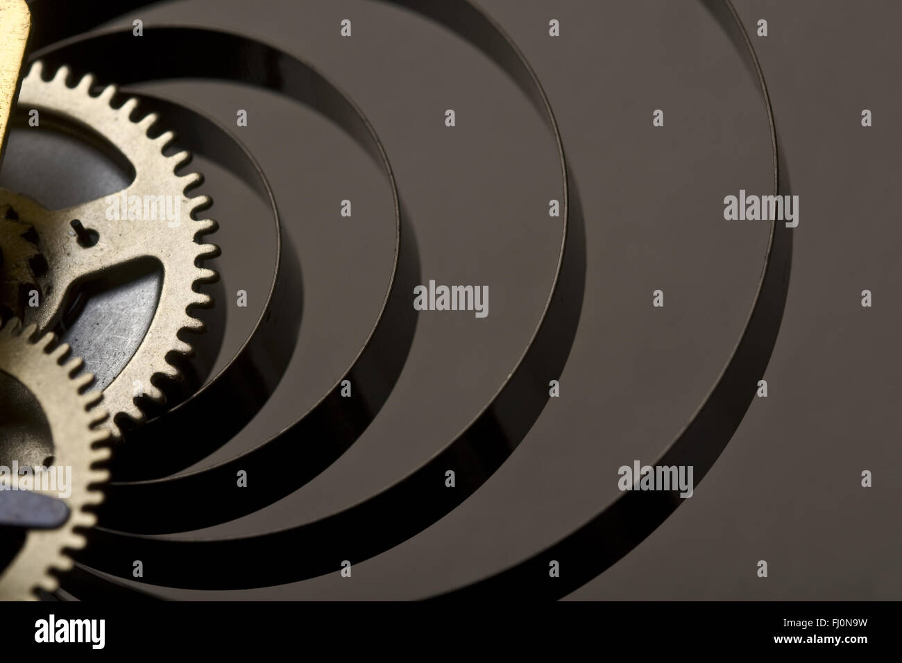 Horizontal close up on the golden cogs of a mechanical clock Stock ...
