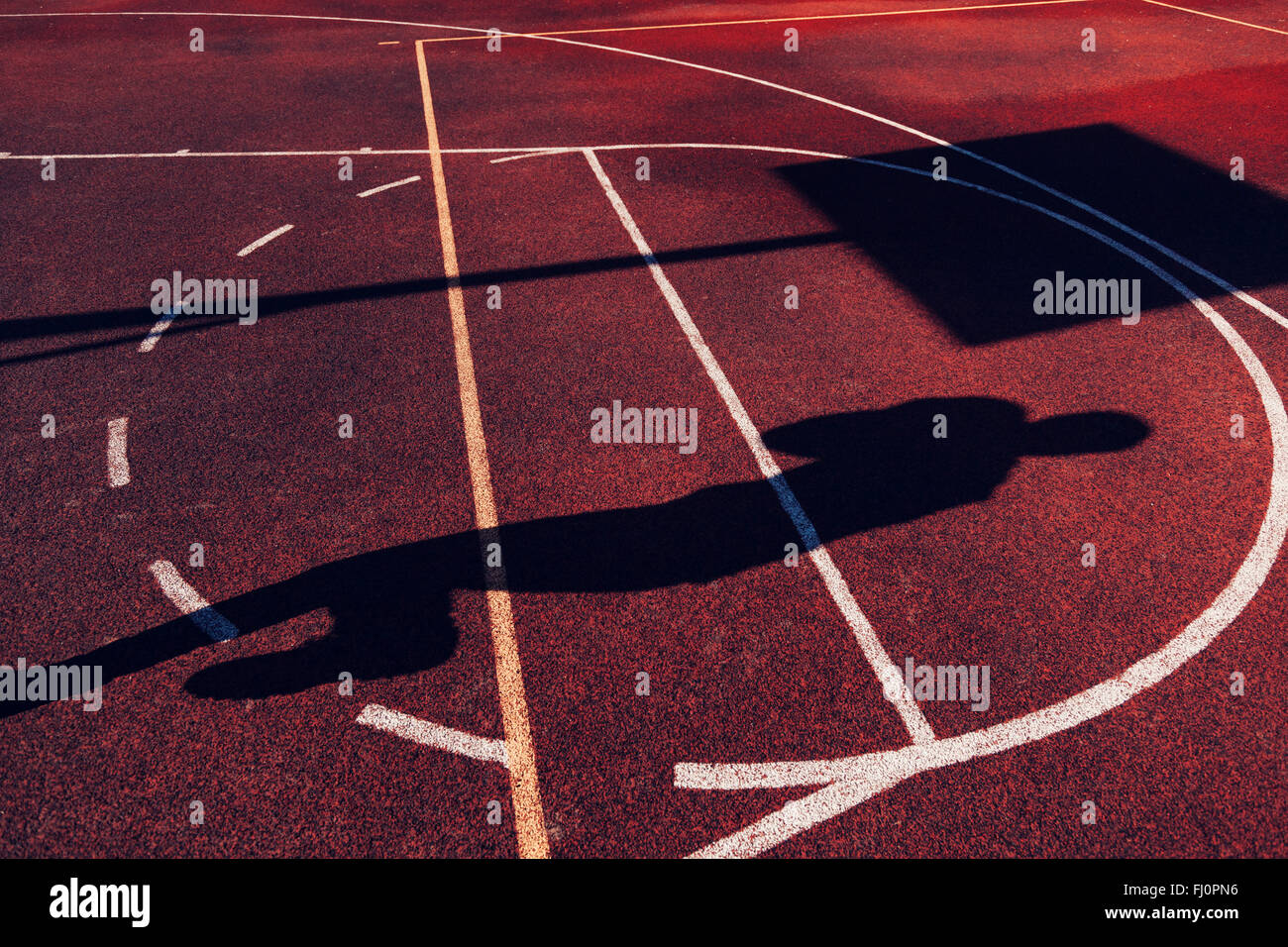 Shadow of basketball player Stock Photo - Alamy
