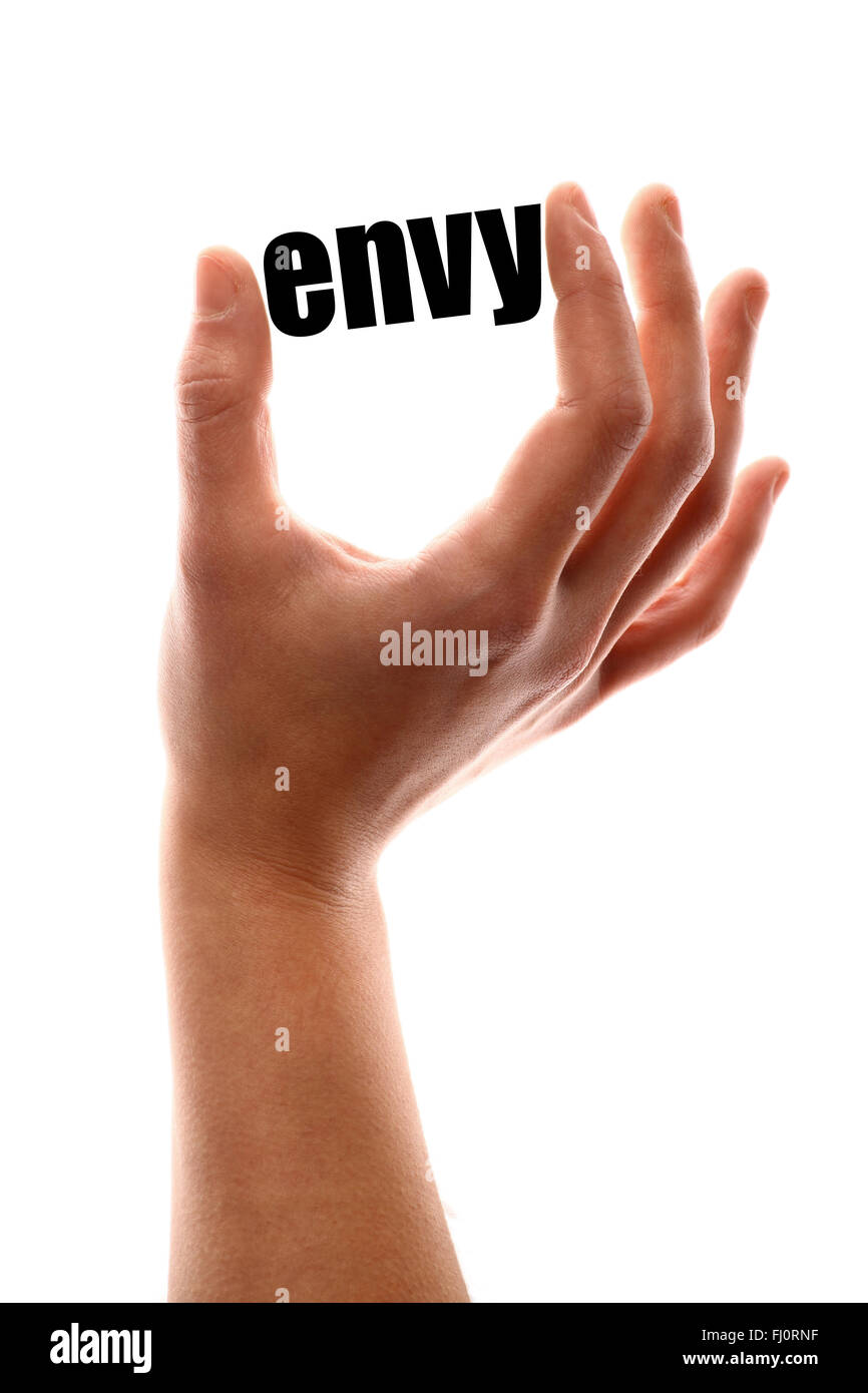 Color vertical shot of a hand squeezing the word "envy Stock Photo - Alamy