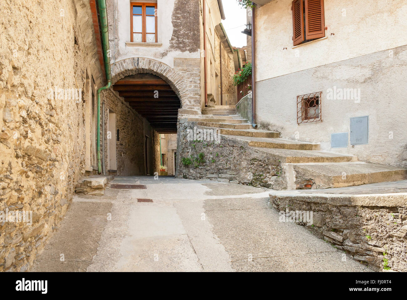 beautiful narrow alley in a small country Stock Photo - Alamy
