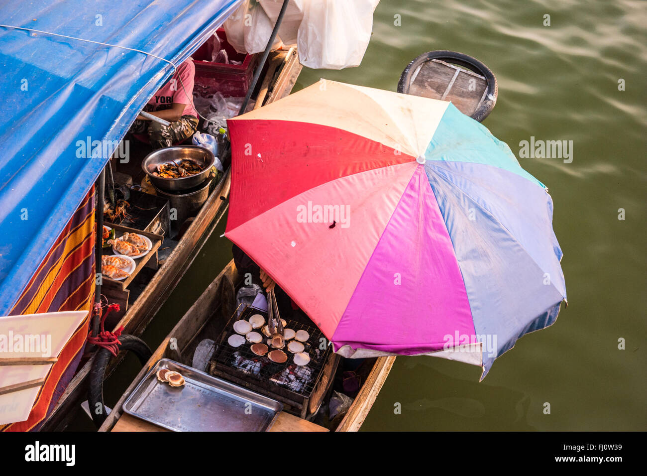Trader's boats in a floating market in Thailand Stock Photo - Alamy