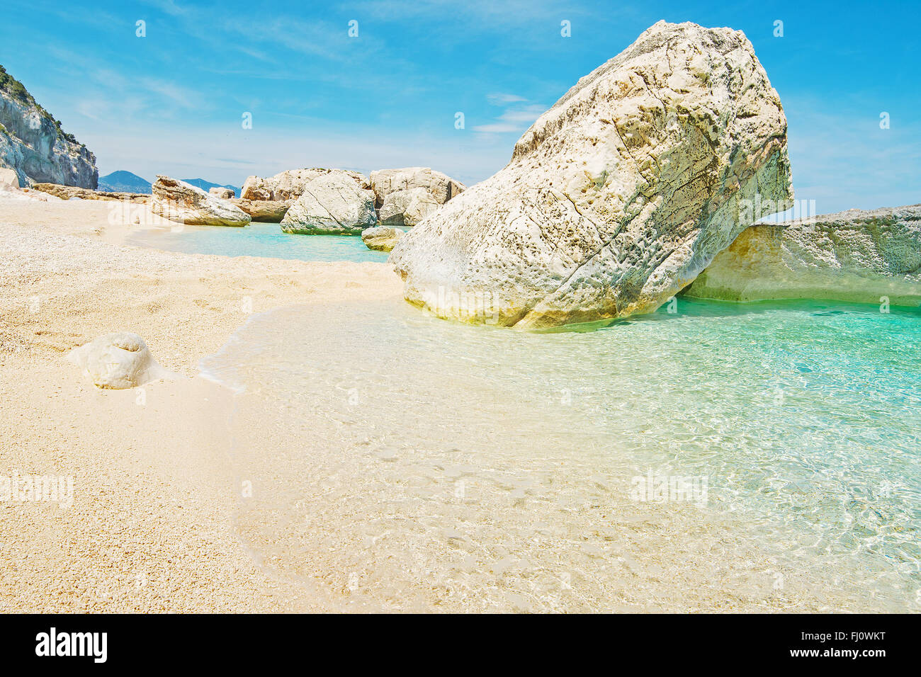 white sand, turquoise sea and rocks in Cala Mariolu, Sardinia Stock ...