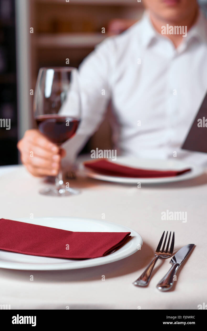 Man sitting at the table in restaurant Stock Photo - Alamy