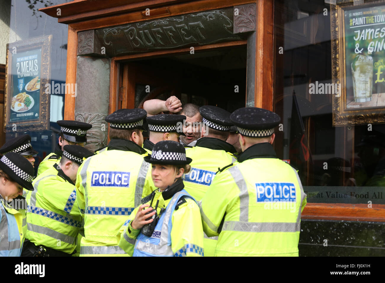 Liverpool, UK. 27th Feb, 2016. Police surround a pub housing right wing ...