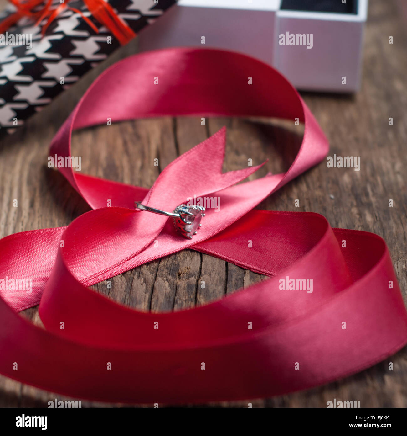 Beautiful pink ribbon with ring Stock Photo - Alamy