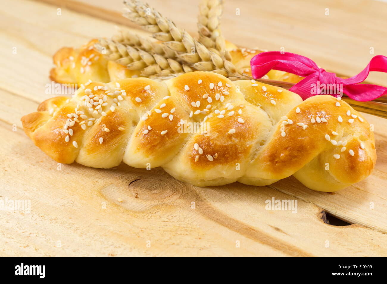 Homemade braid pastry with wheat plant and a ribbon Stock Photo - Alamy