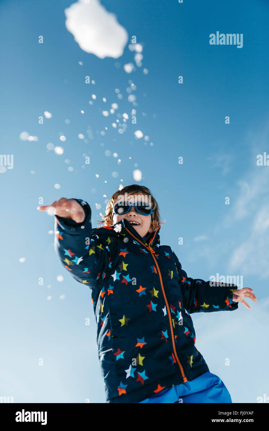 Little boy throwing snowball Stock Photo - Alamy