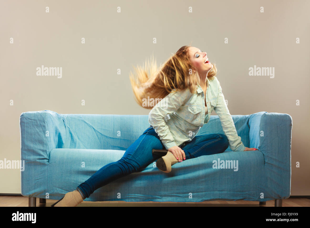 Young people happiness concept. Fashionable girl wearing denim relaxing ...