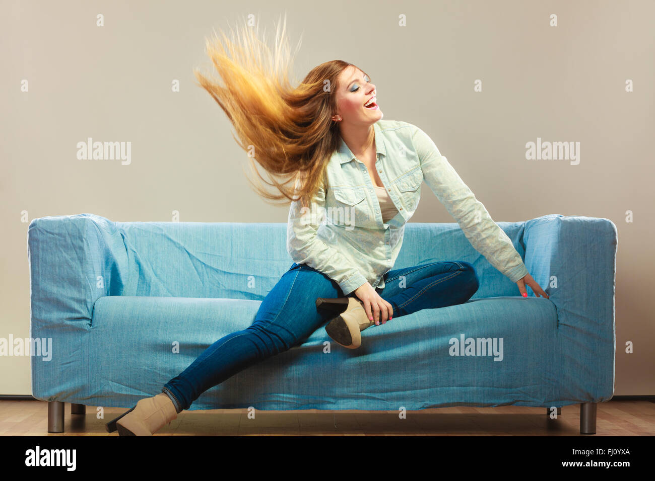 Young people happiness concept. Fashionable girl wearing denim relaxing ...