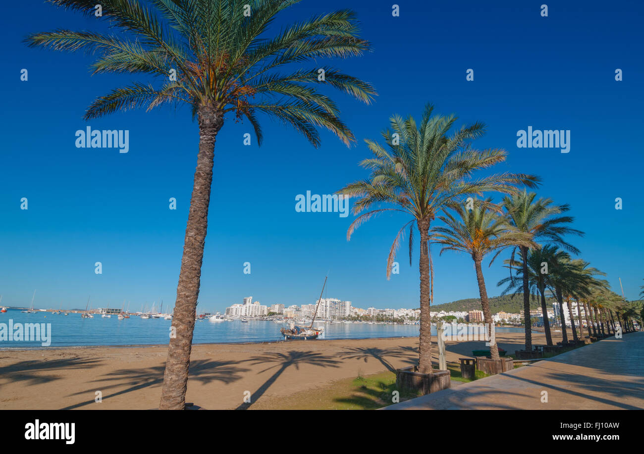 Mid morning sun on Ibiza waterfront. Warm sunny day along the beach in ...