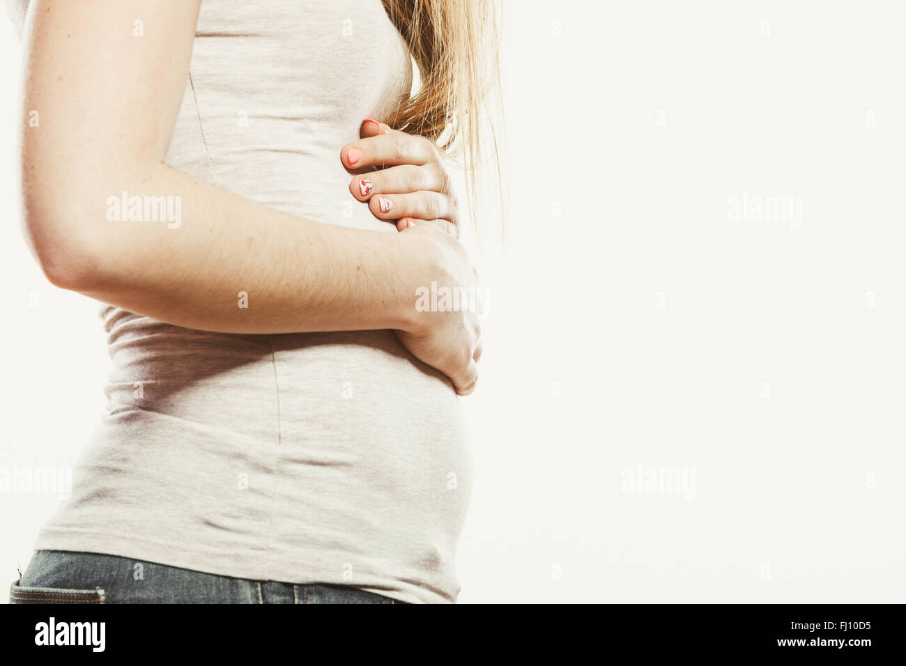 Human suffering from stomachache pain. Person having period bellyache ...