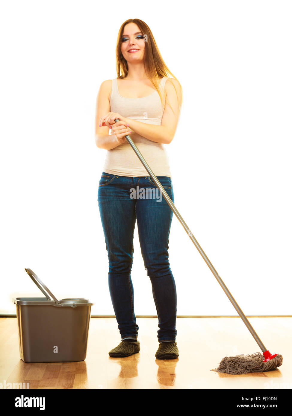 Spring cleaning concept. young woman mopping floor, standing with old ...