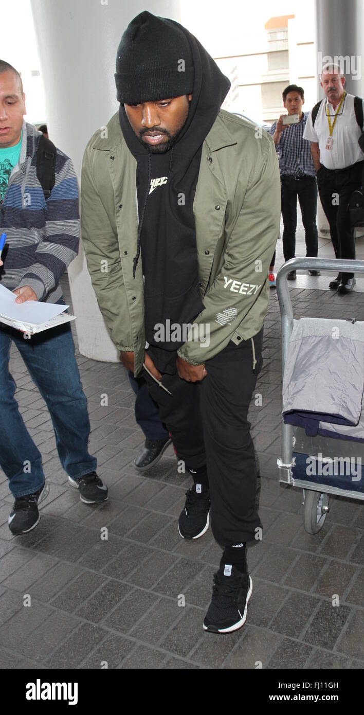 Kanye West departs on a flight from Los Angeles International Airport ...