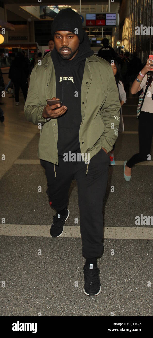 Kanye West departs on a flight from Los Angeles International Airport ...