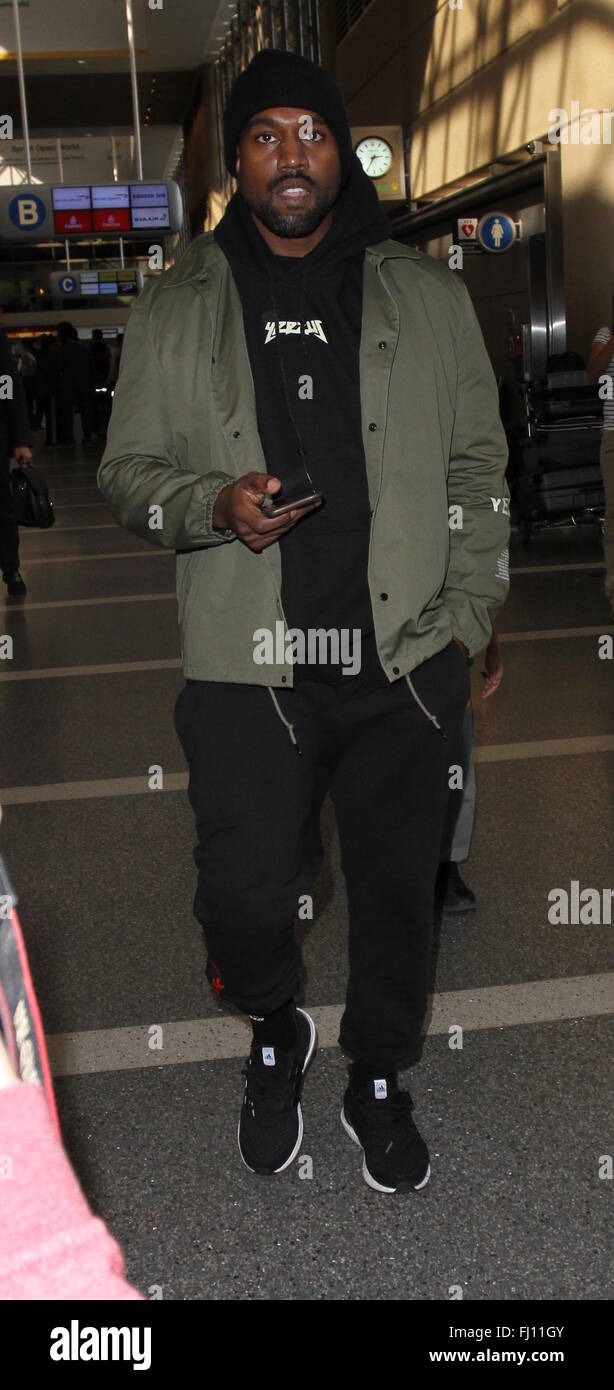 Kanye West departs on a flight from Los Angeles International Airport ...
