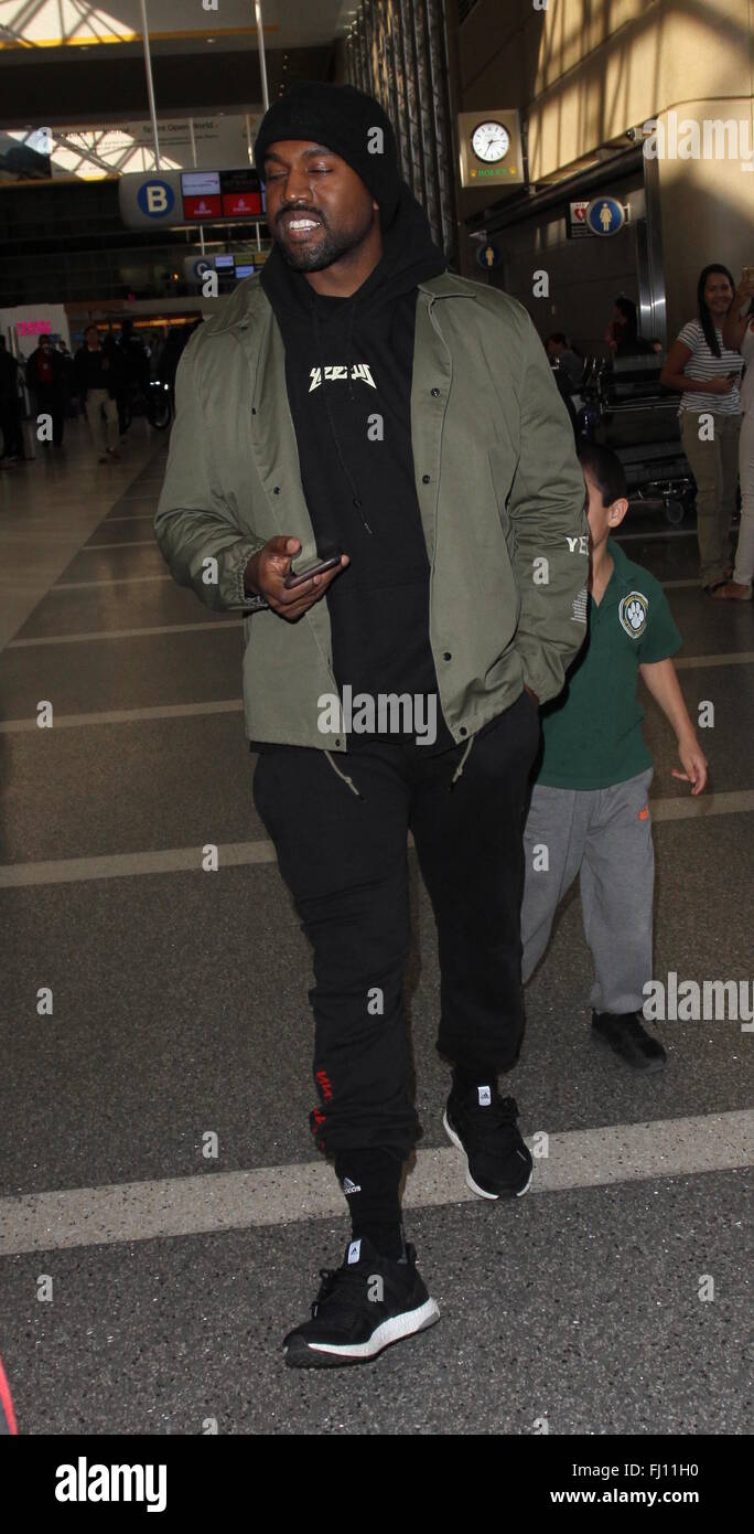 Kanye West departs on a flight from Los Angeles International Airport ...