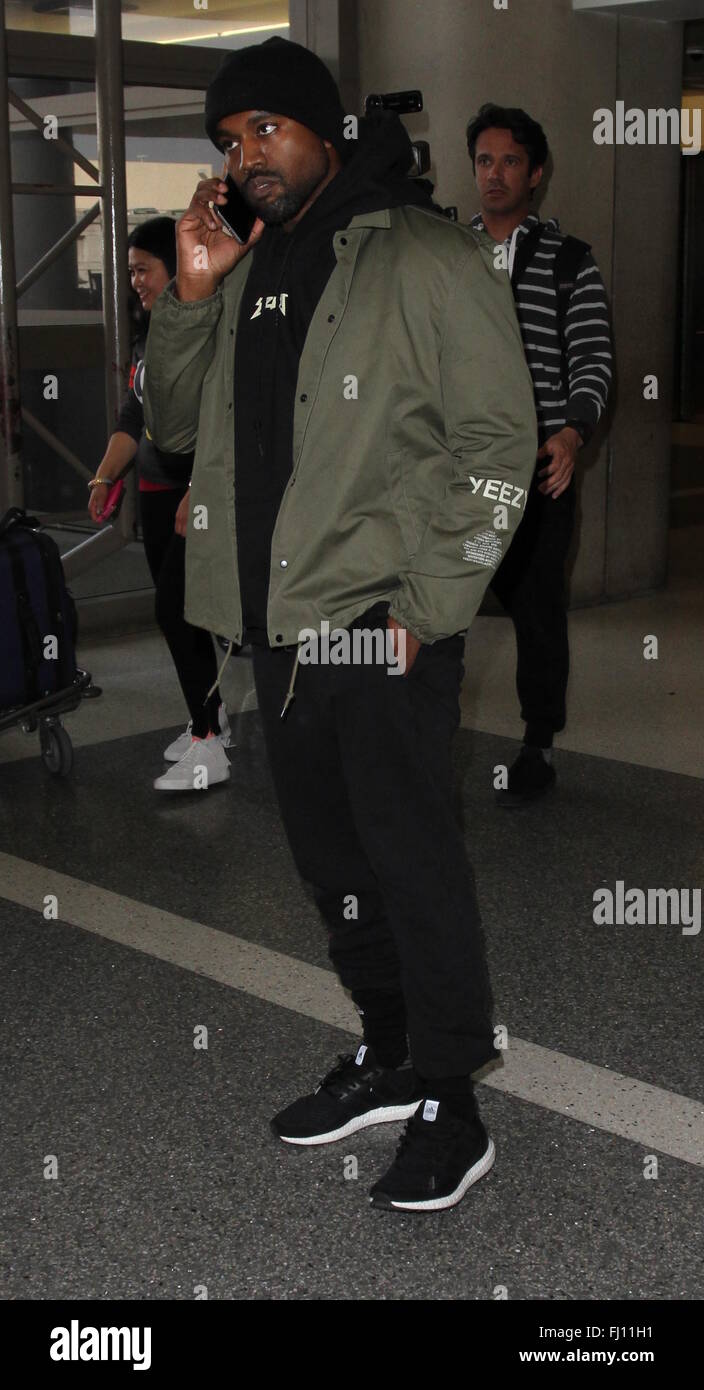 Kanye West departs on a flight from Los Angeles International Airport ...