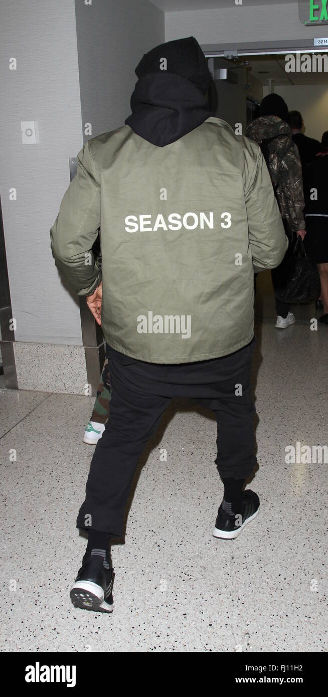 Kanye West departs on a flight from Los Angeles International Airport ...
