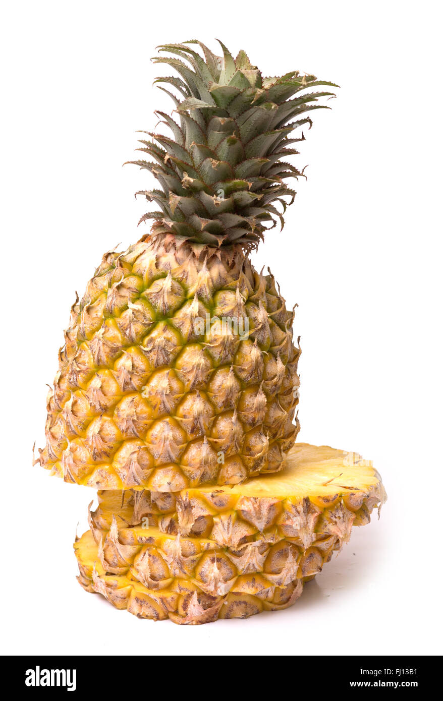 ripe pineapple with slices isolated on white background Stock Photo - Alamy