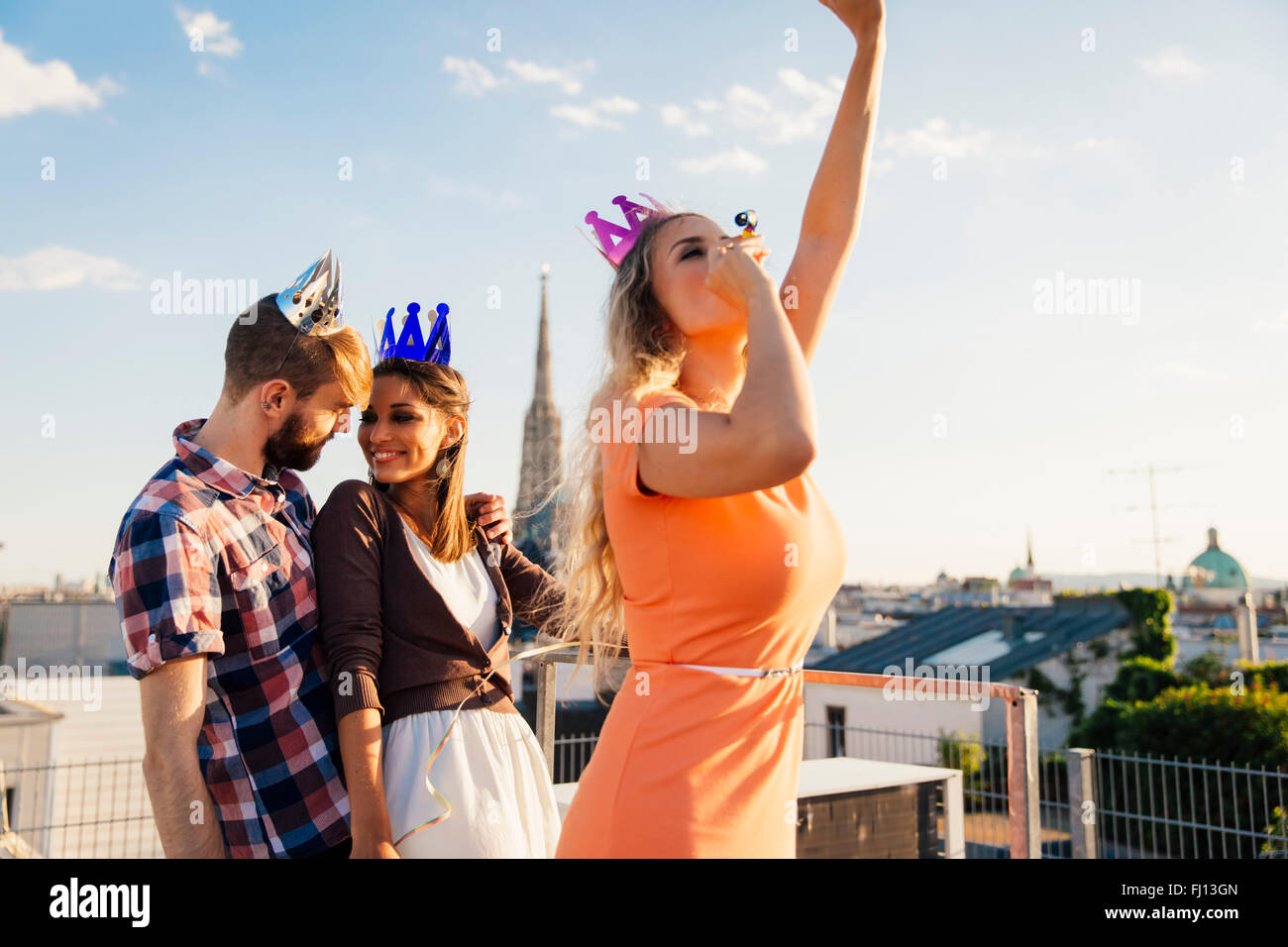 Austria, Vienna, Young people having a party on rooftop terrace Stock ...